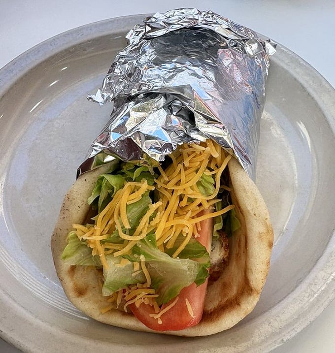 The humble pita transformed into a portable feast &ndash; fresh veggies and melted cheese create the perfect handheld harmony.