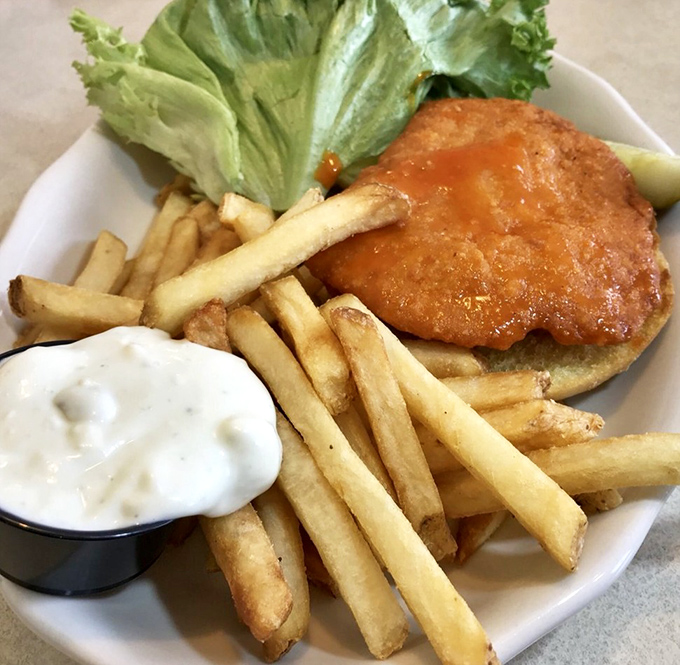 This isn't just a sandwich&mdash;it's architecture with flavor. The golden-fried chicken and crispy fries are playing a symphony your taste buds can hear.