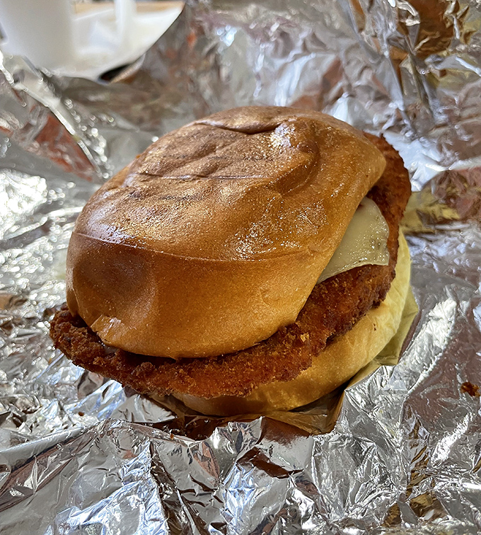 This chicken sandwich isn't just wearing a bun &ndash; it's strutting down the runway in bread couture that perfectly frames its golden-fried glory.