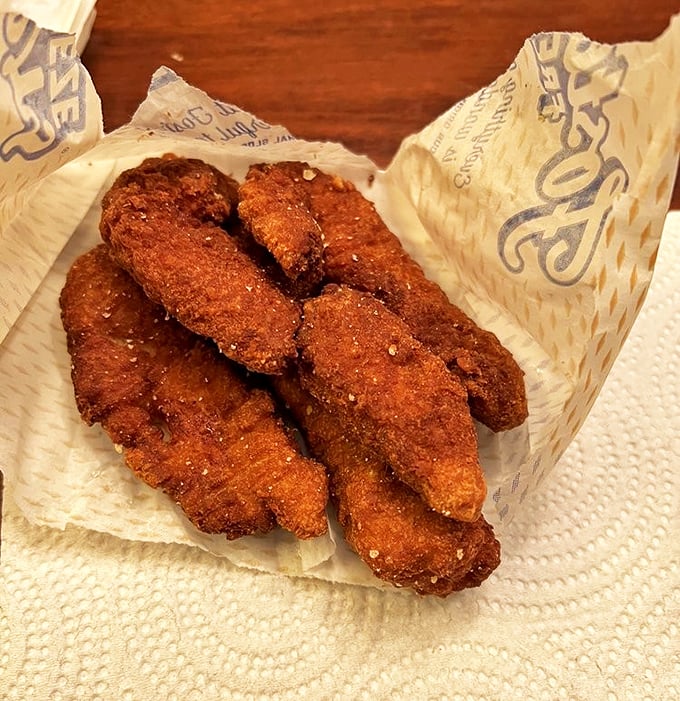 Golden-brown chicken strips that could make Colonel Sanders question his life choices – crispy perfection in finger food form.