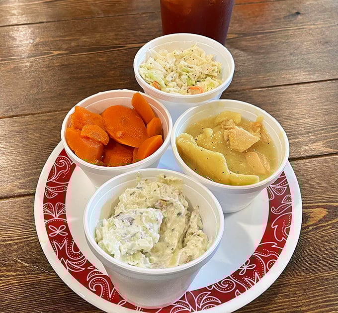 A quartet of comfort&mdash;potato salad, coleslaw, chicken and dumplings, and carrots. This plate is what Midwestern dreams are made of.