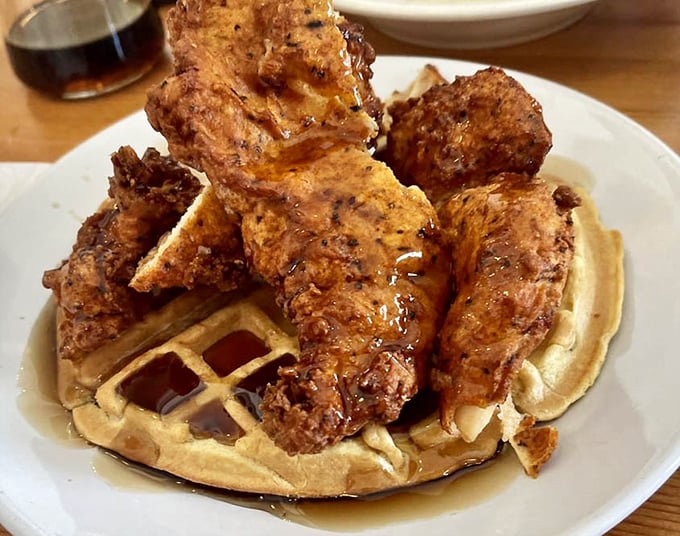 Chicken and waffles: the breakfast-lunch alliance that works better than most political compromises, drizzled with maple syrup perfection.