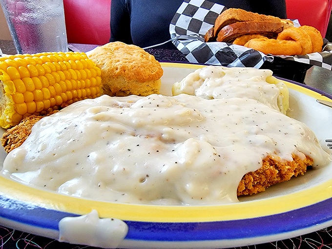 Chicken fried steak swimming in country gravy alongside corn proves Missouri knows how to feed people properly.