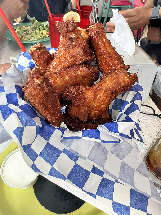 These chicken wings aren't just fried, they're transformed&mdash;crispy, glistening monuments to the art of comfort food that demand to be photographed before devoured.