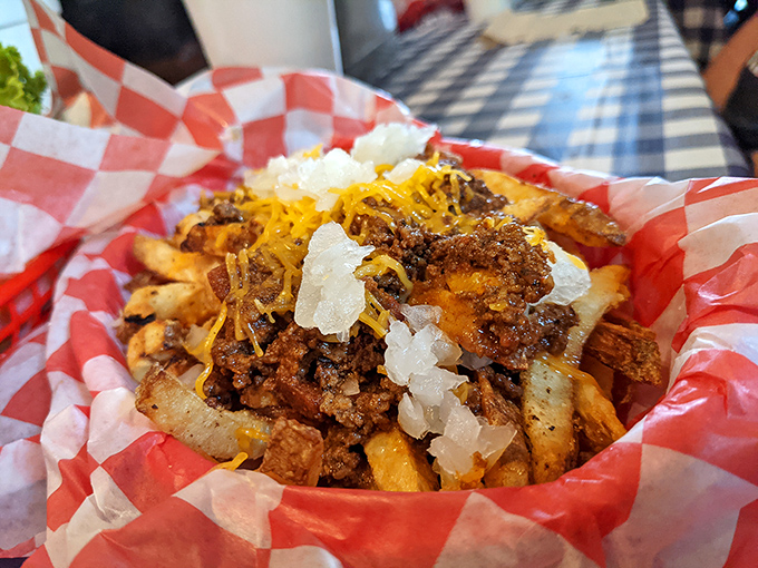 Loaded fries topped with seasoned ground beef, melted cheese, and diced onions &ndash; a hearty side that could be a meal itself.