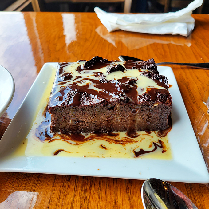 The legendary chocolate bread pudding, swimming in custard sauce. This isn't dessert&mdash;it's an out-of-body experience that happens to involve chocolate.