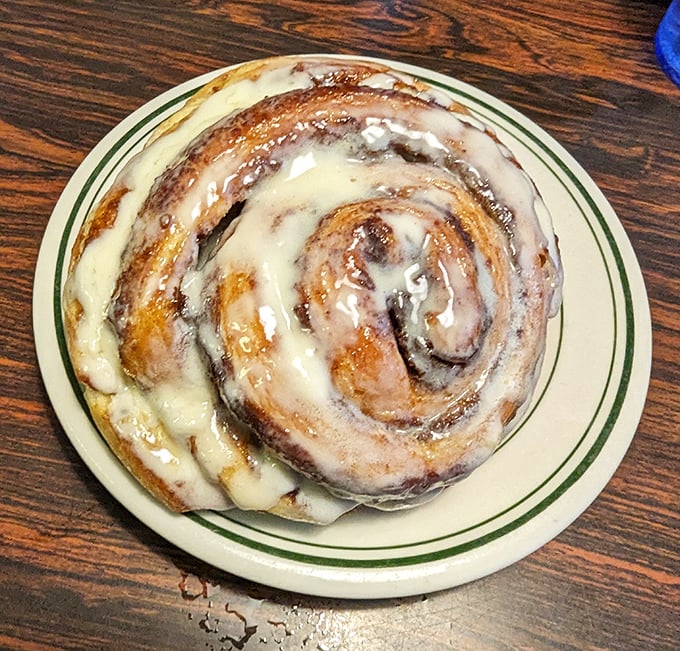 This cinnamon roll isn't just breakfast &ndash; it's dessert masquerading as a morning meal, with icing melting into every warm, cinnamon-scented crevice.