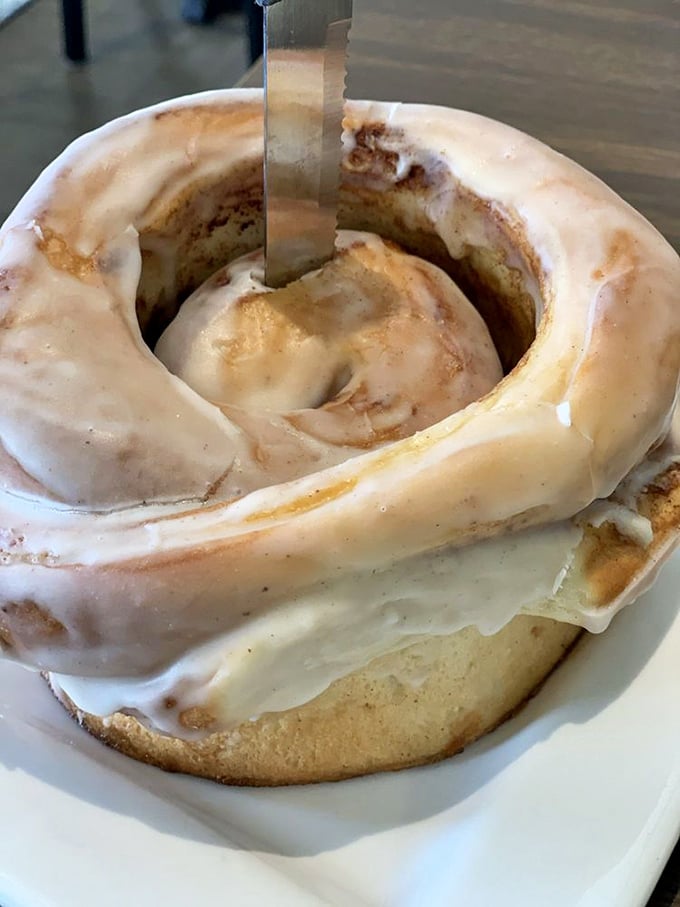 The cinnamon roll isn't just a pastry, it's an architectural achievement of swirled perfection that demands to be eaten with a knife and childlike wonder.