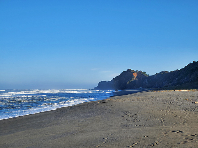 The kind of beach day that makes poets reach for their notebooks. Golden sunlight bathes the shoreline while waves perform their endless rhythm.