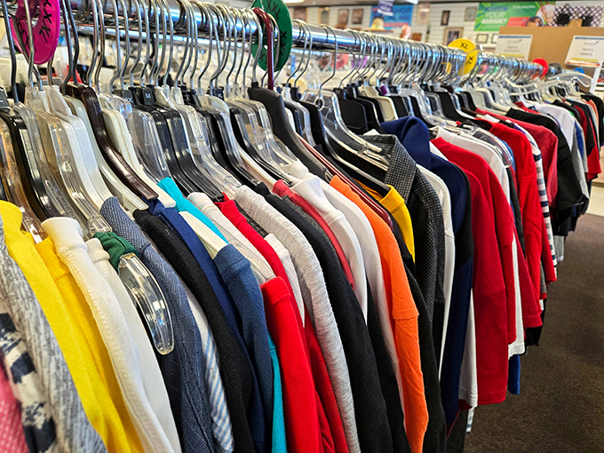 The rainbow of secondhand shirts tells a color story more interesting than anything you'll find at the mall. Fashion recycled, reimagined, reborn.