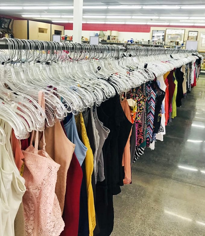 A rainbow of women's clothing creates a colorful tapestry of fashion history, with each hanger holding someone's former favorite.