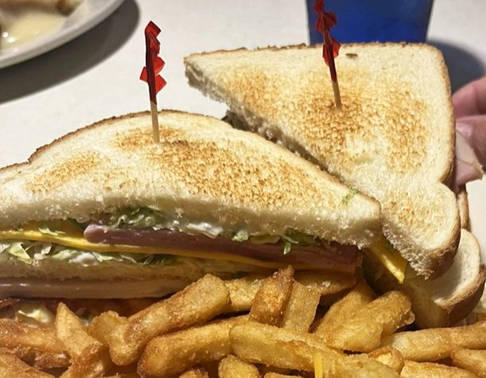 A club sandwich that stands tall and proud, layered like a delicious skyscraper of flavor. Architecture you can eat.