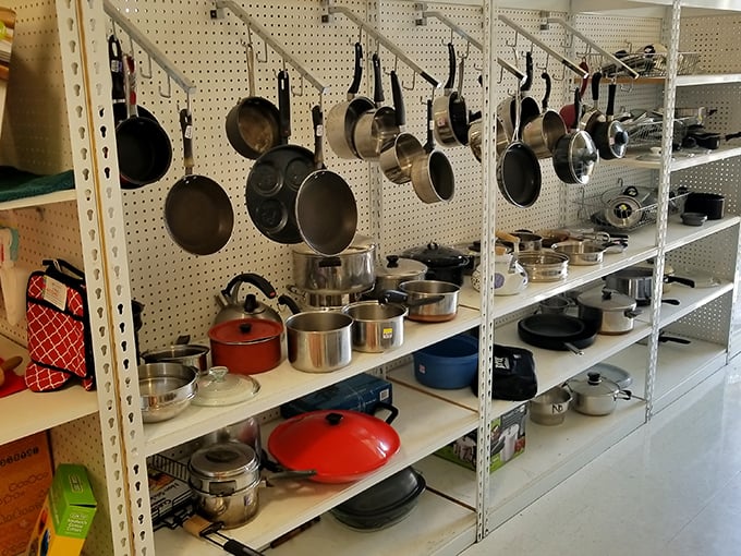 The cookware section: where professional-grade pots hang like medals of honor, ready for their second act in someone else's kitchen drama.