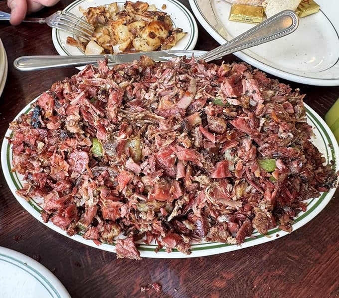A mountain of corned beef that makes you wonder if they've somehow discovered a fifth dimension to fit between two modest slices of rye.