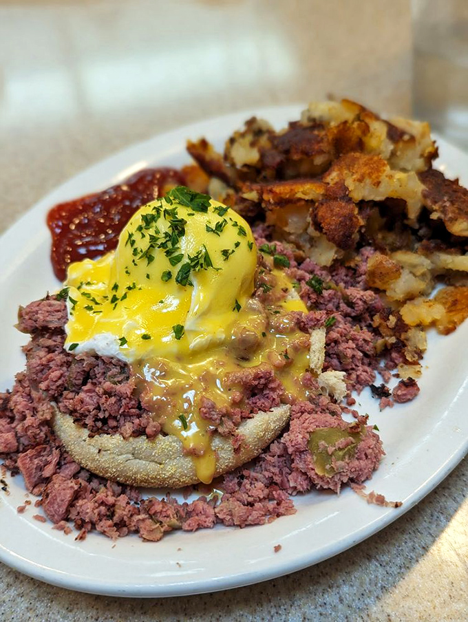 Corned beef benedict that would make your cardiologist wince and your taste buds sing. That egg yolk is nature's perfect sauce.