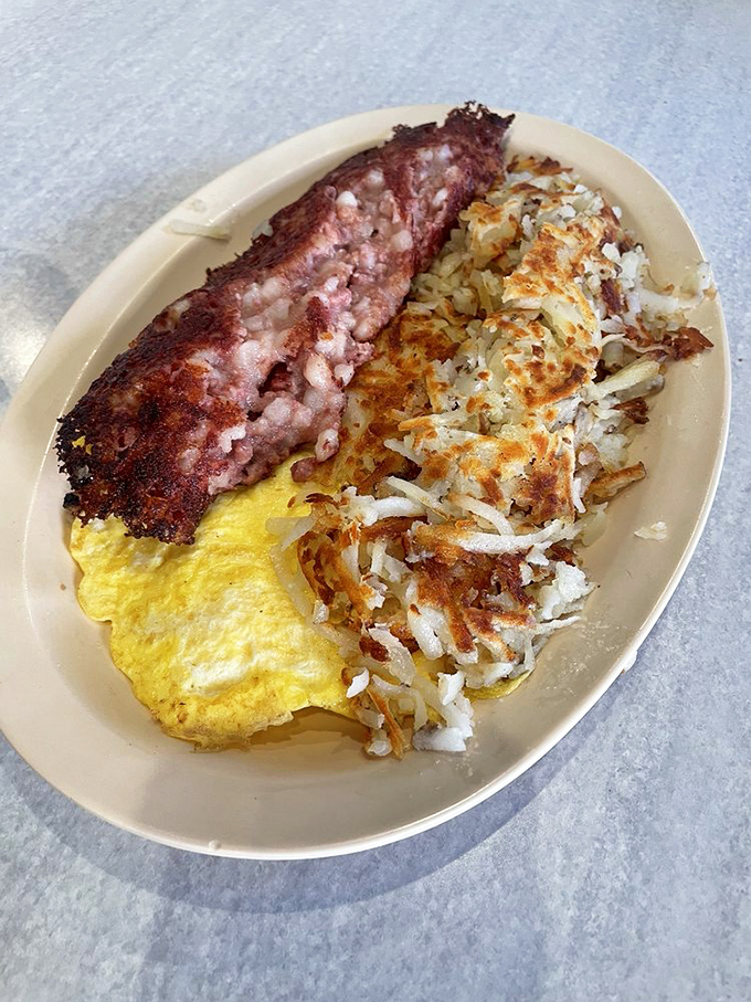 Crispy-edged corned beef hash with perfectly cooked eggs and hash browns. The holy trinity of breakfast that's worth setting an alarm for.