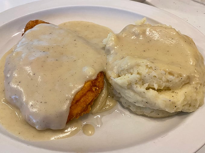 Country fried steak smothered in gravy, because sometimes your arteries deserve a vacation from being responsible.