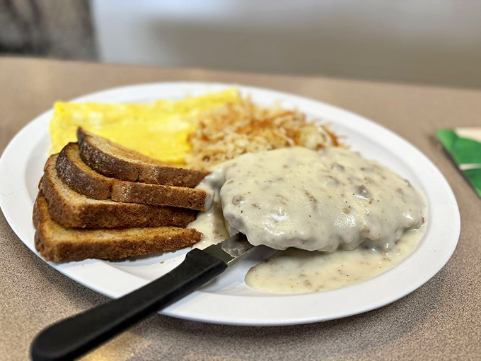 Country fried steak swimming in peppery gravy alongside eggs and hash browns is the kind of hearty meal that makes you grateful to be alive.