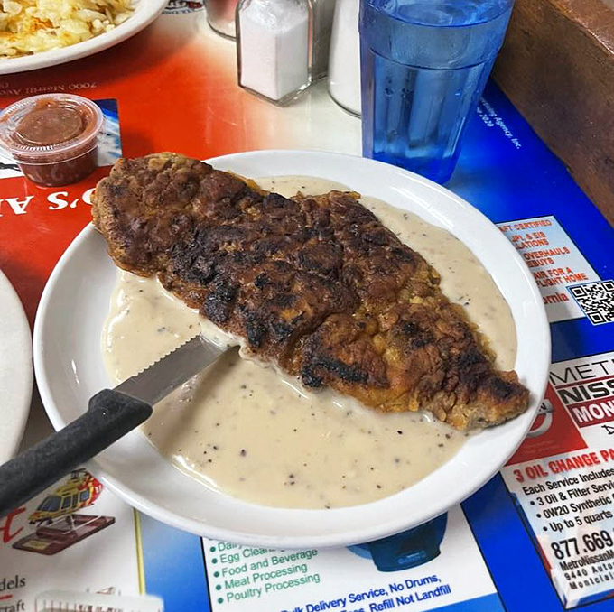 Country fried steak that's practically performing a magic trick: simultaneously crispy and tender, swimming in gravy that deserves its own fan club.