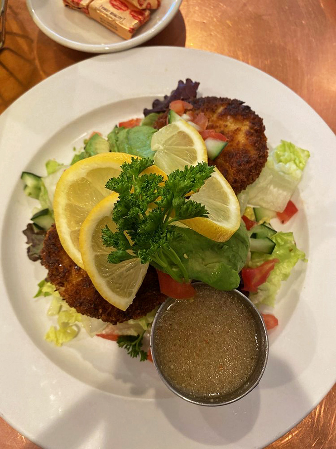 Golden-crusted perfection topped with fresh greens – these crab cakes know how to make an entrance.
