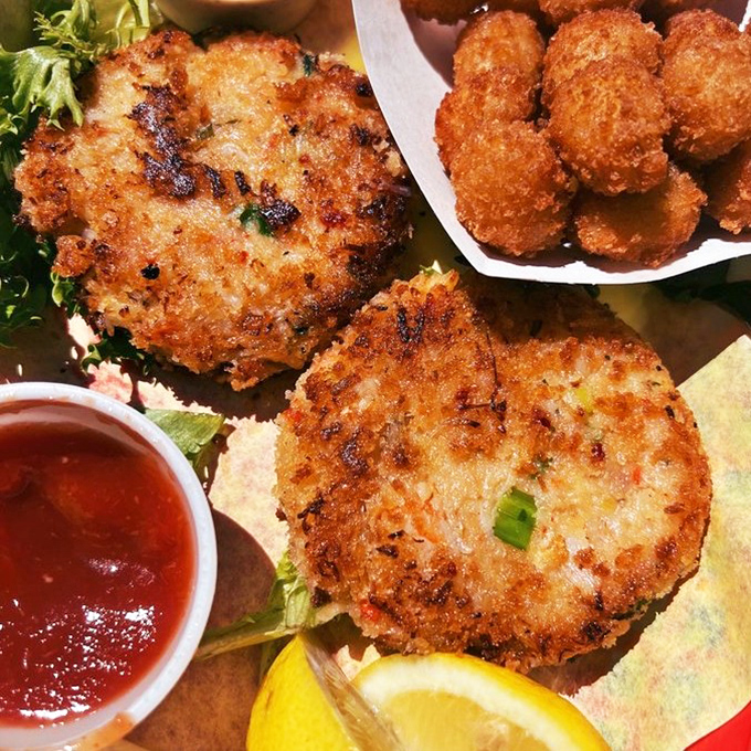House-made crab cakes showcase generous chunks of sweet crab held together by seasoned maritime magic.