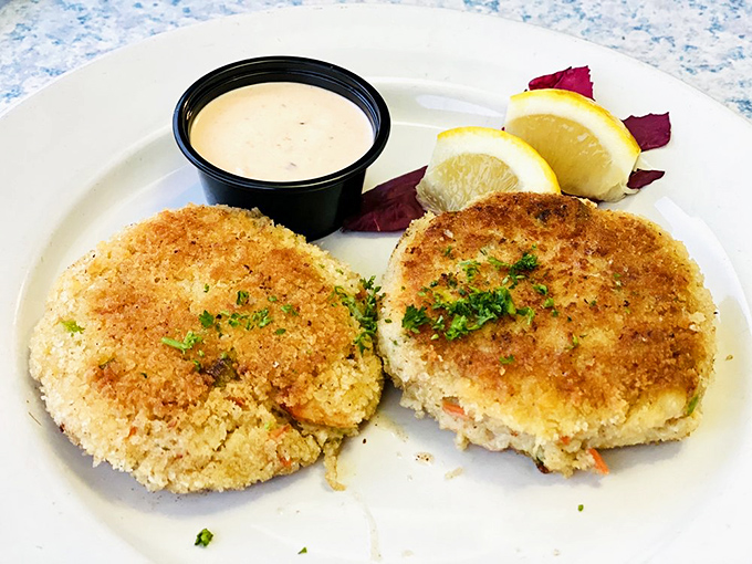 These crab cakes aren't just golden brown—they're what happens when crab meat fulfills its highest purpose. Crispy exterior, tender interior, and absolutely no filler nonsense.
