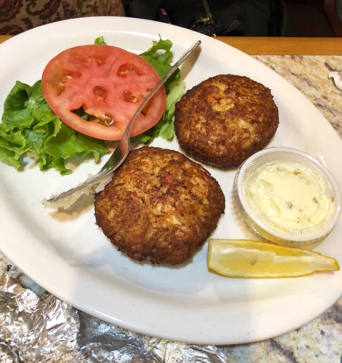 These crab cakes aren't just food; they're edible proof that simplicity and quality ingredients create magic. The tartar sauce is just the supporting actor.