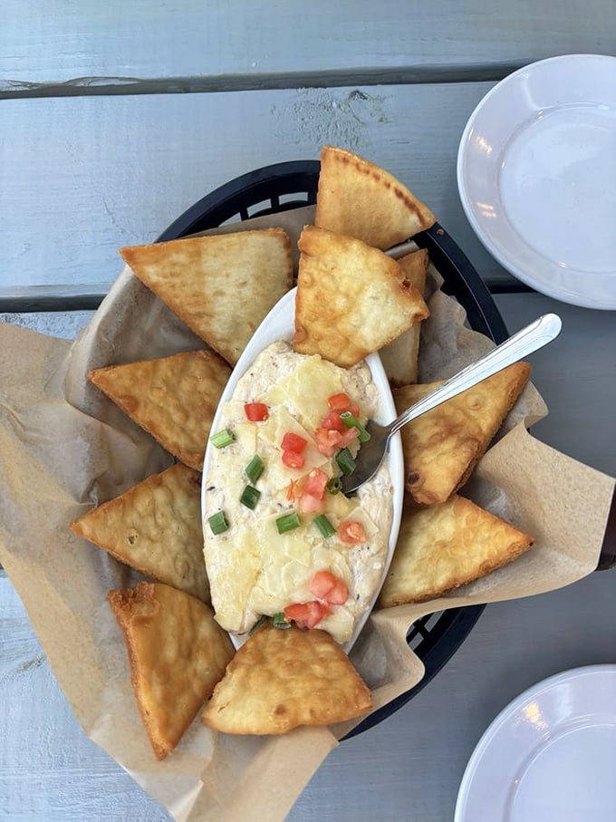 This crab dip surrounded by golden triangles of fried pita creates a game of "how much can I pile on without breaking?"