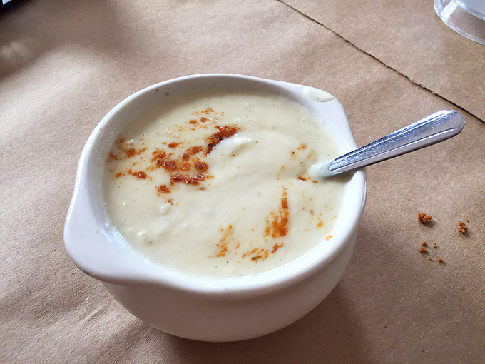 The cream of crab soup arrives like a warm hug in a bowl, velvety and rich with sweet lumps of crab meat peeking through.