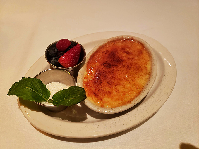 Crème brûlée with that satisfying crack of caramelized sugar and fresh berries makes the perfect sweet ending.
