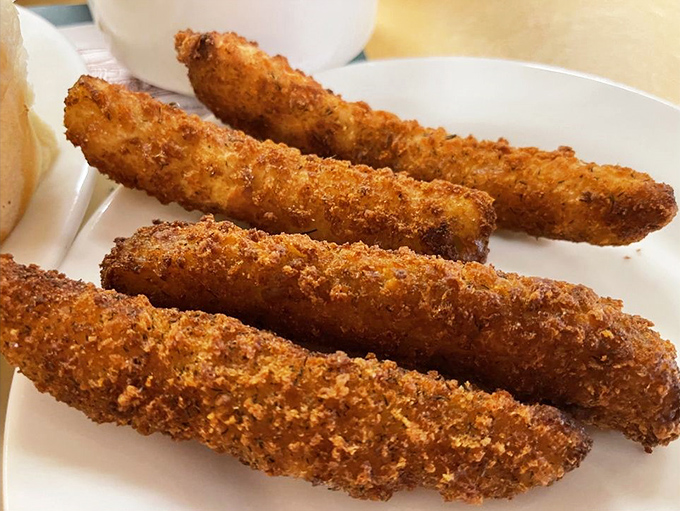 These golden-brown breaded sticks aren't just appetizers; they're crispy vessels of joy that disappear from the plate with suspicious speed.