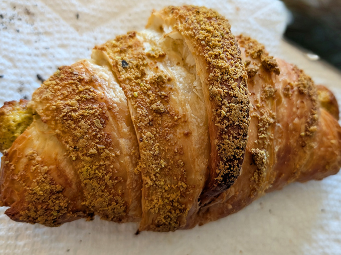 This isn't just a croissant—it's layers of buttery history with a dusting of "who needs swimsuit season anyway?"