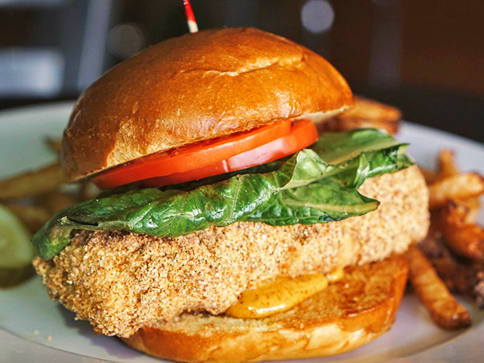This golden-crusted cod sandwich is the kind of honest bar food that makes you wonder why anyone bothers with white tablecloths and tiny portions.