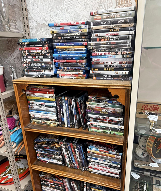 DVD shelves packed tighter than a Thanksgiving fridge&mdash;John Wayne westerns to modern blockbusters waiting for movie night at prices that won't require a second mortgage.