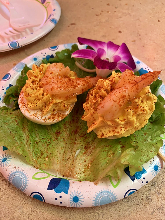 Deviled eggs get the royal treatment here, adorned with paprika and served with the kind of presentation that makes you pause before devouring.