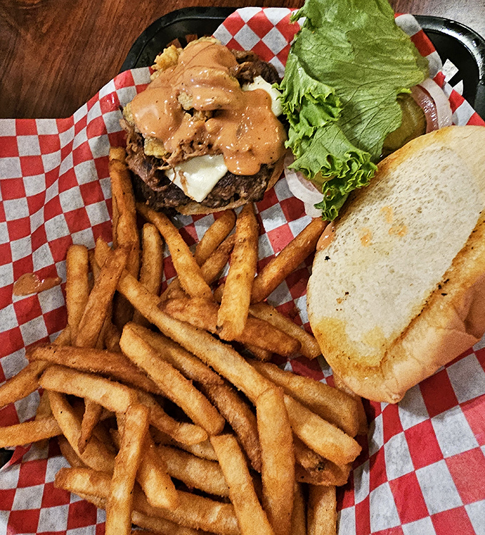 This isn't just a burger&mdash;it's an engineering marvel of beef, cheese, and special sauce that requires both hands and several napkins.