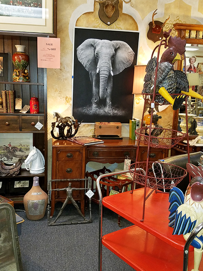 This blue-walled booth is what happens when maximalism meets meticulous curation. That elephant painting silently judges your decorating choices.