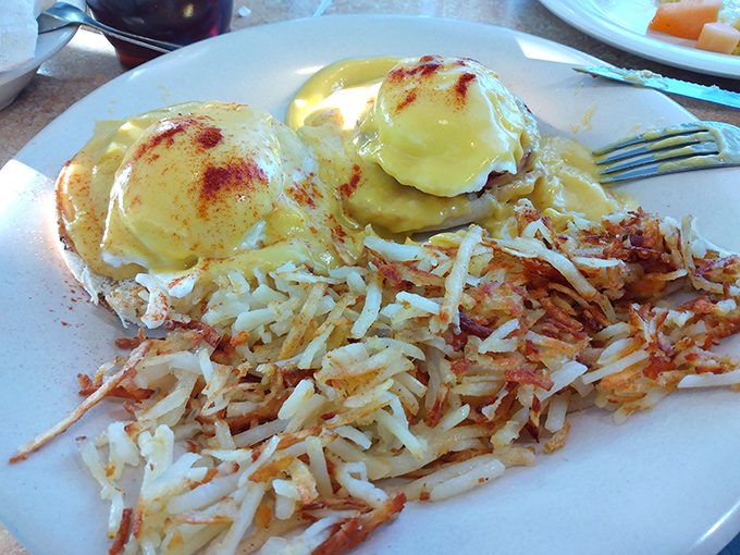 Eggs Benedict that would make a brunch snob weep with joy &ndash; perfectly poached eggs nestled on a throne of crispy hash browns.