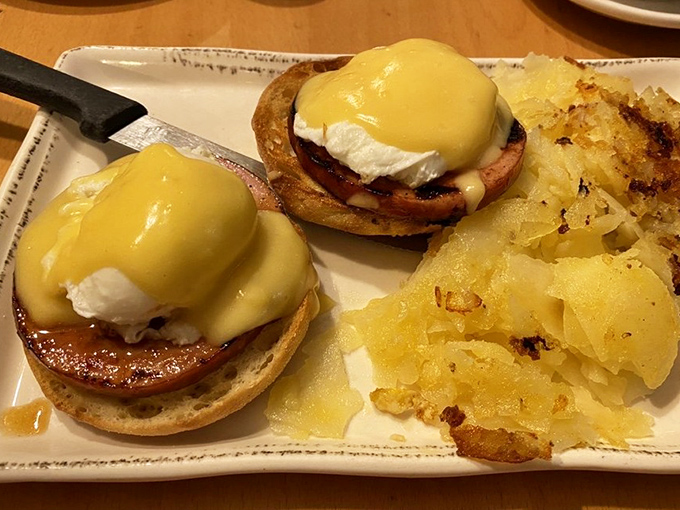 Classic Eggs Benedict done right: perfectly poached eggs, hollandaise that doesn't quit, and golden home fries on the side.