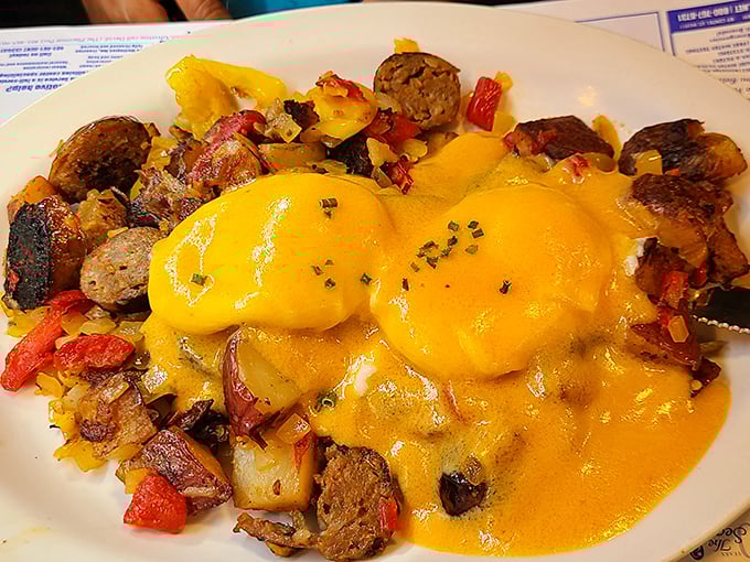 Eggs Benedict with a side of food envy. That hollandaise sauce looks so rich it probably has its own offshore account.