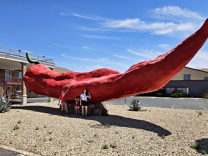 Family memories are made in the shadow of the giant chile, where "standing under a pepper" becomes an unexpected vacation highlight.