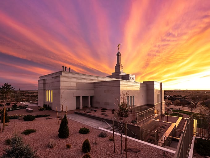 The Snowflake Arizona Temple glows like a beacon at sunset. Its striking architecture stands in beautiful contrast to the dramatic desert sky.