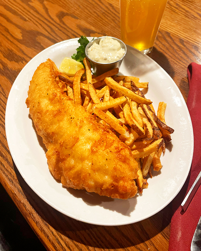 Fish and chips that would make a British pub nervous about its reputation. That golden batter shatters like your New Year's resolutions. 