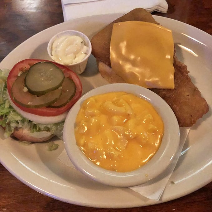 A plate that speaks the universal language of comfort&mdash;crispy sandwich, creamy mac and cheese, and fresh veggies. The holy trinity of diner perfection.