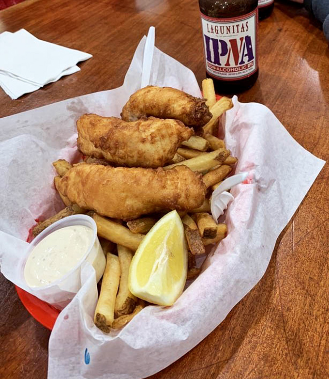Golden-battered fish and perfectly crisp fries served with a wedge of lemon—comfort food that tastes like a salty sea breeze feels.