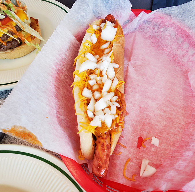 The footlong hot dog, dressed to impress with cheese and onions, proves that sometimes the simple pleasures are the ones that stretch the furthest.