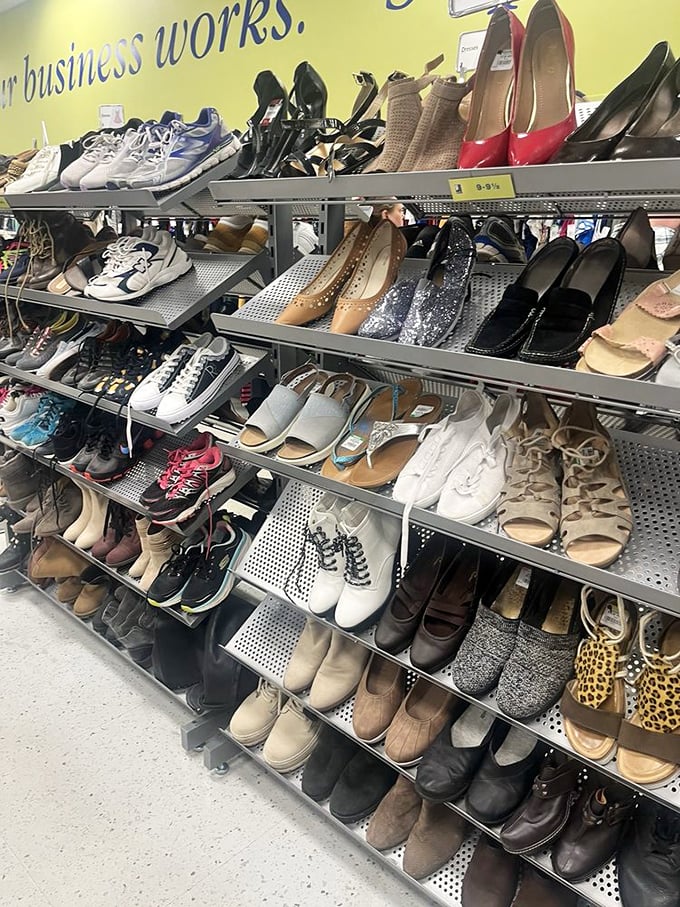 Shoe paradise organized by size, where barely-worn designer heels mingle with practical sneakers in a footwear democracy of affordability.