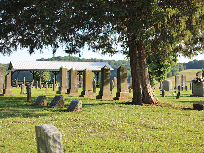 Cemetery grounds that whisper stories of the past, where history rests peacefully under the watchful gaze of ancient trees.