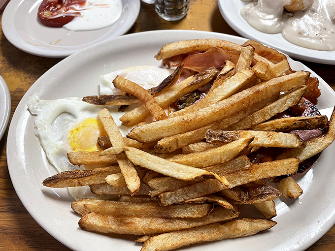 Hand-cut fries with the perfect crisp-to-fluffy ratio, alongside eggs that remind you breakfast is always the right choice.
