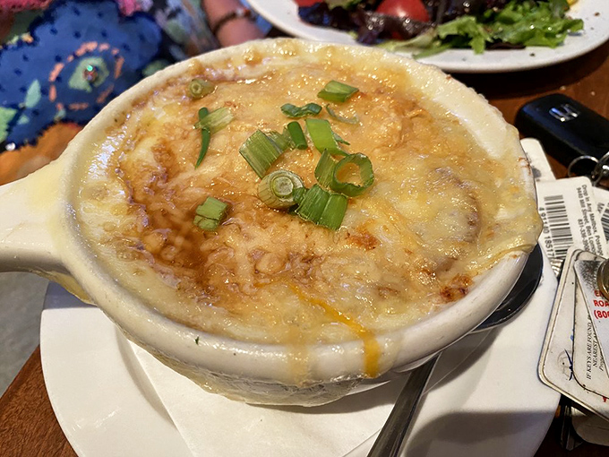 French onion soup that doesn't just warm your body but hugs your soul&mdash;a bubbling cauldron of comfort topped with melted cheese.
